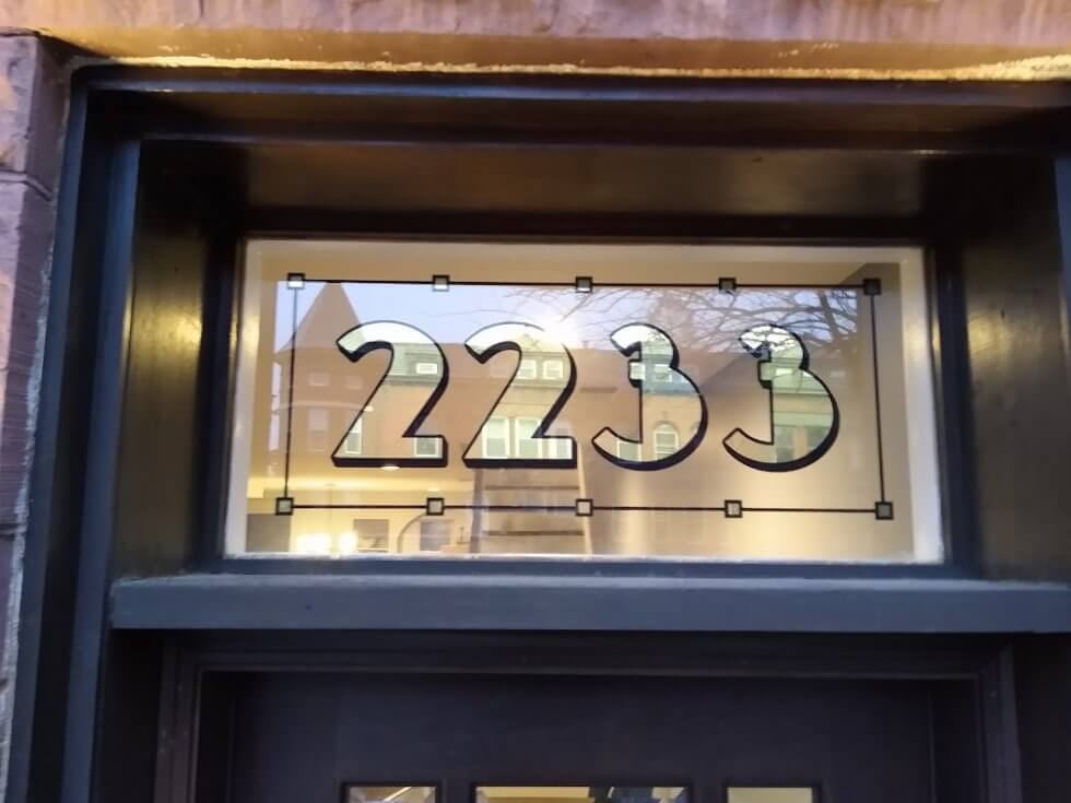 Gold Door Numbers. Vintage transom numbers at 2233
